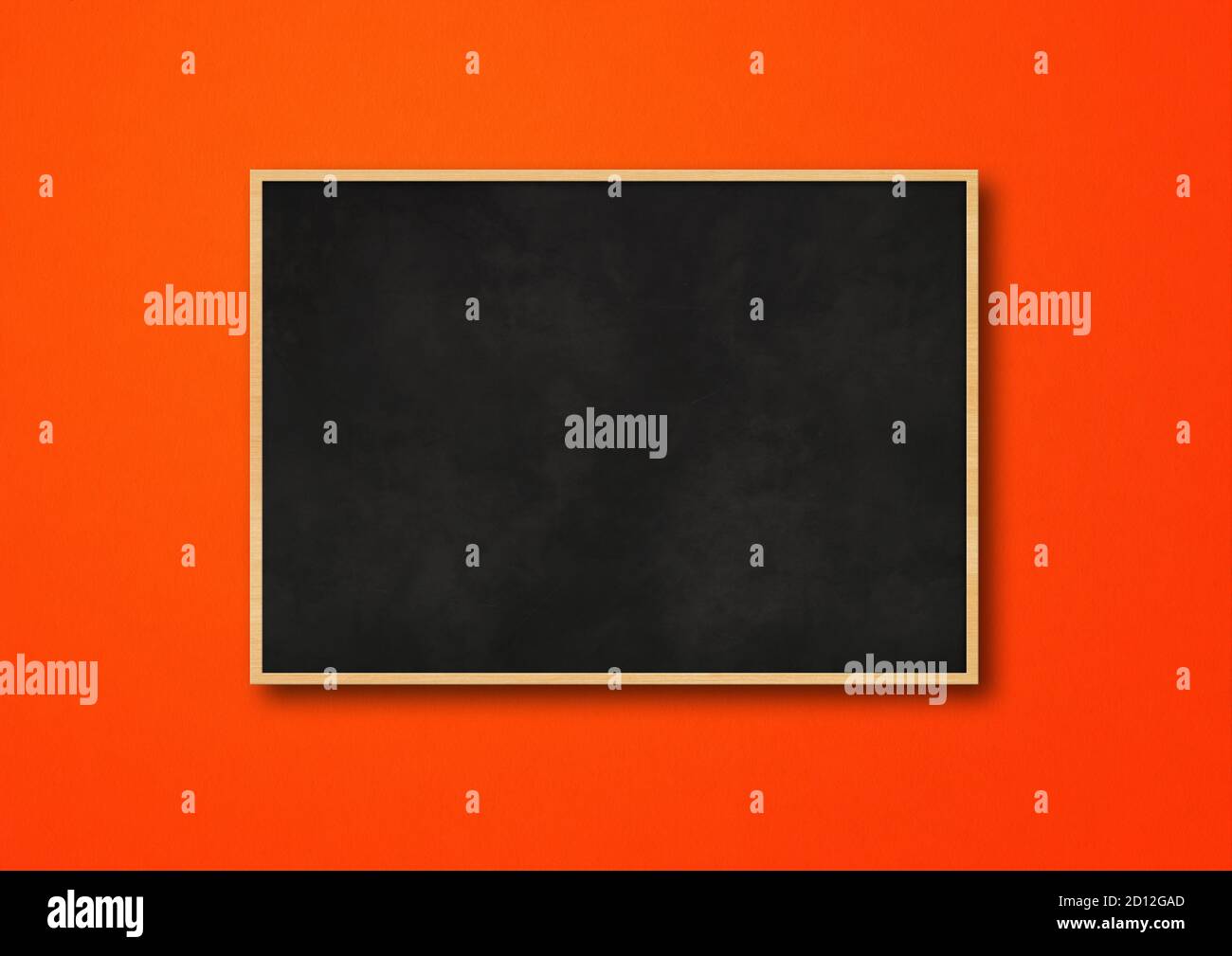 Traditional black board isolated on a red background. Blank horizontal ...