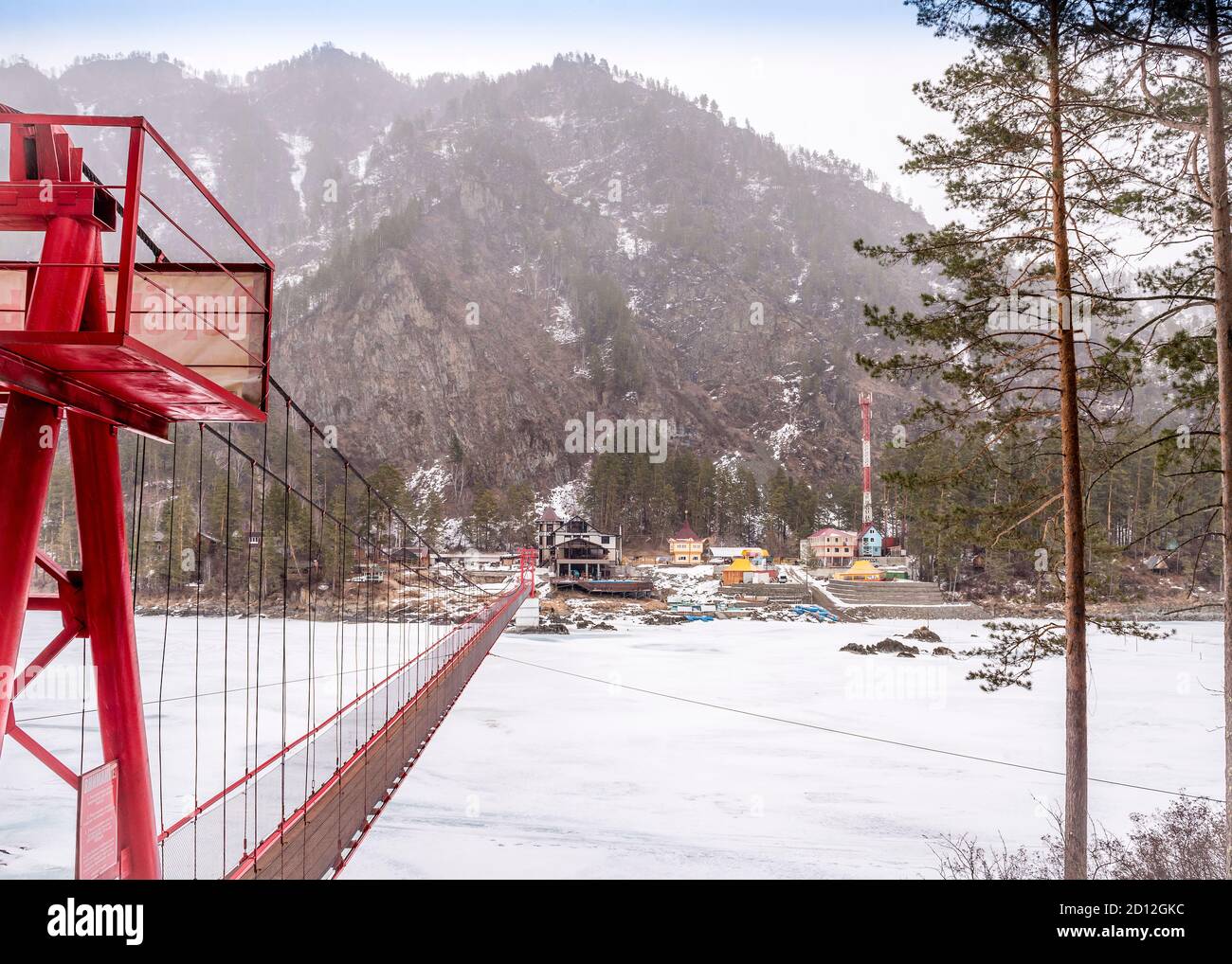 Red rope bridge with the poster "Rope bridge" and a board with the text ...