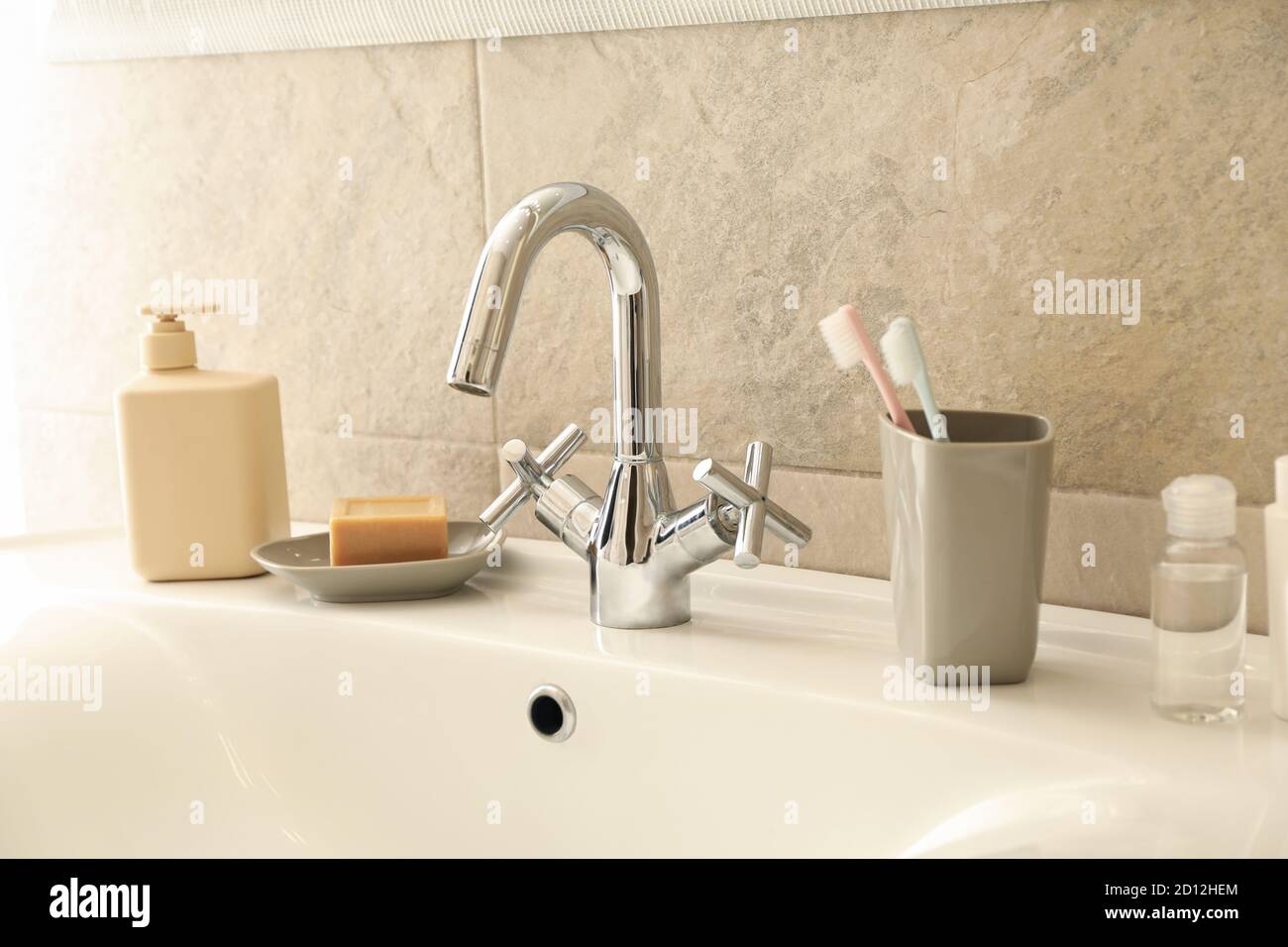 Sink and personal hygiene accessories in bathroom Stock Photo - Alamy