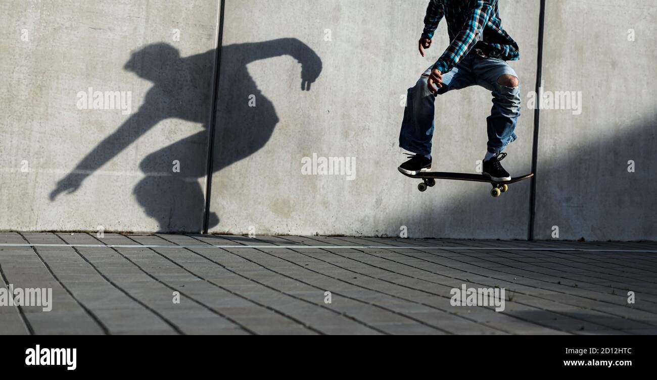 Skateboarder riding fast towards the ramps to be lifted into the air ...