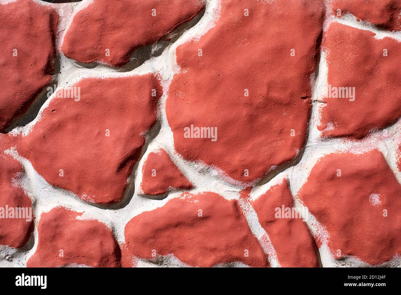 The texture of a homemade plaster fence, painted artificial stone of ...