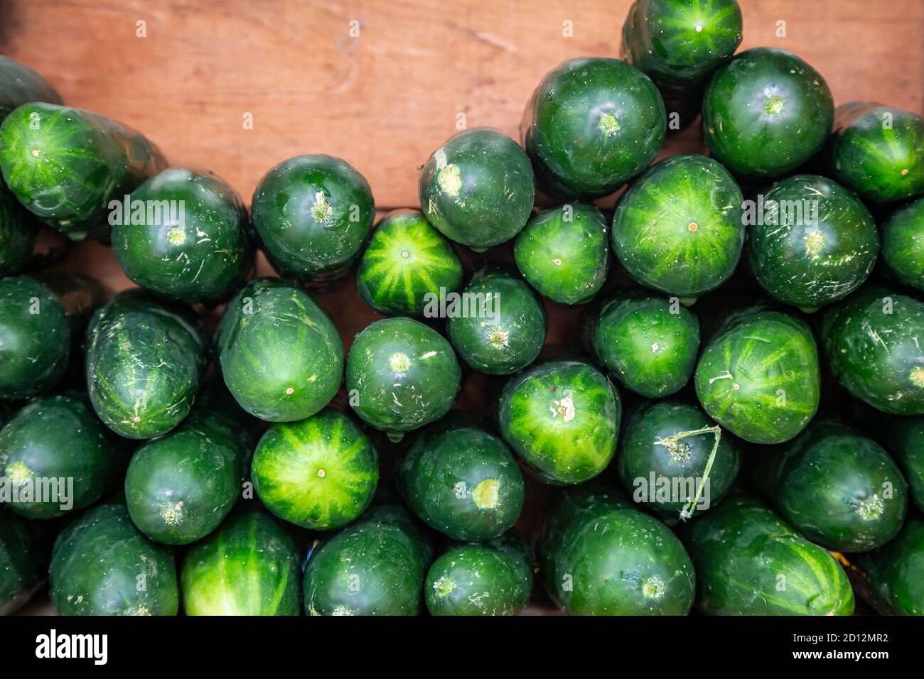 A display of courgettes/zucchini, for sale on a farmers market stall ...