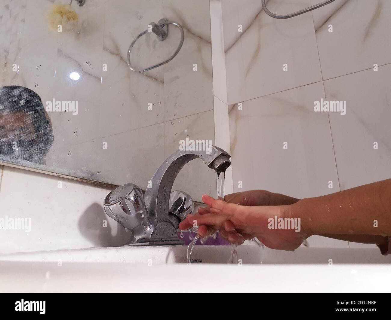 Washing hands in bathroom by masked Children during coronavirus ...