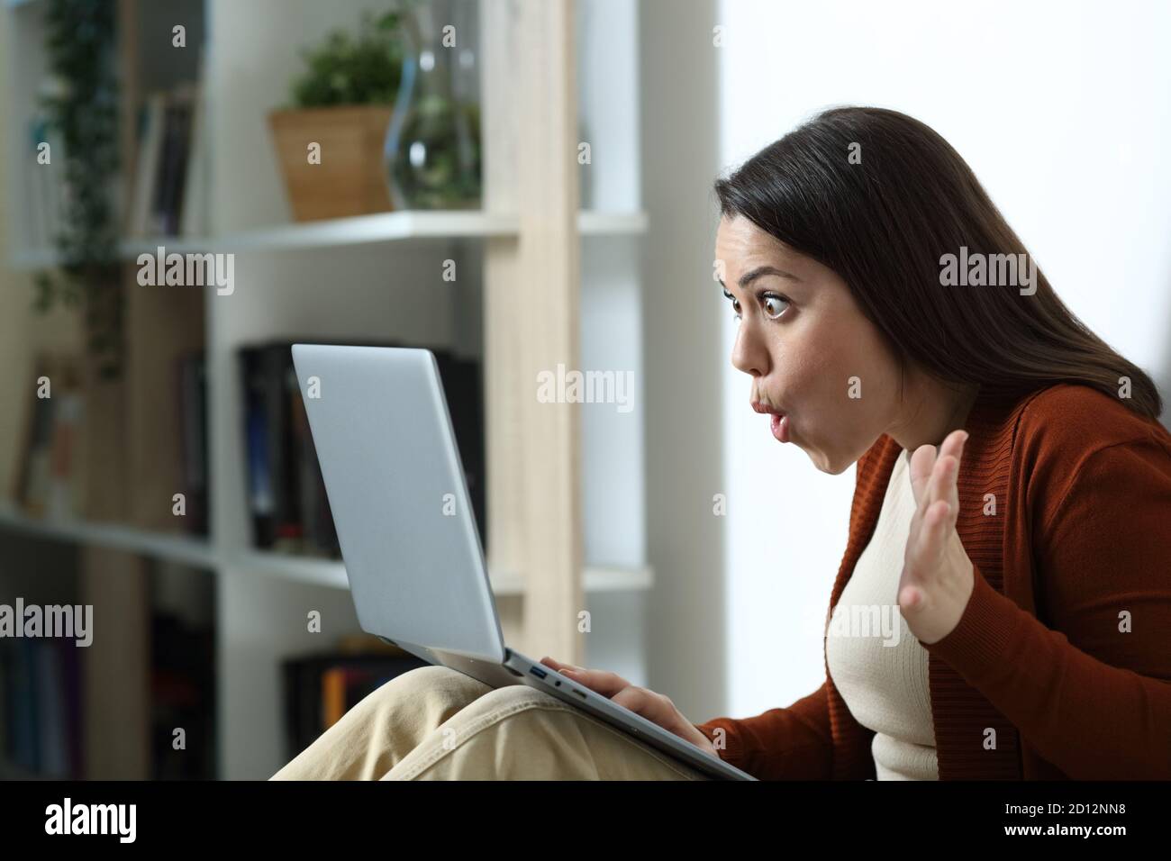 Excited woman computer home hi-res stock photography and images - Alamy