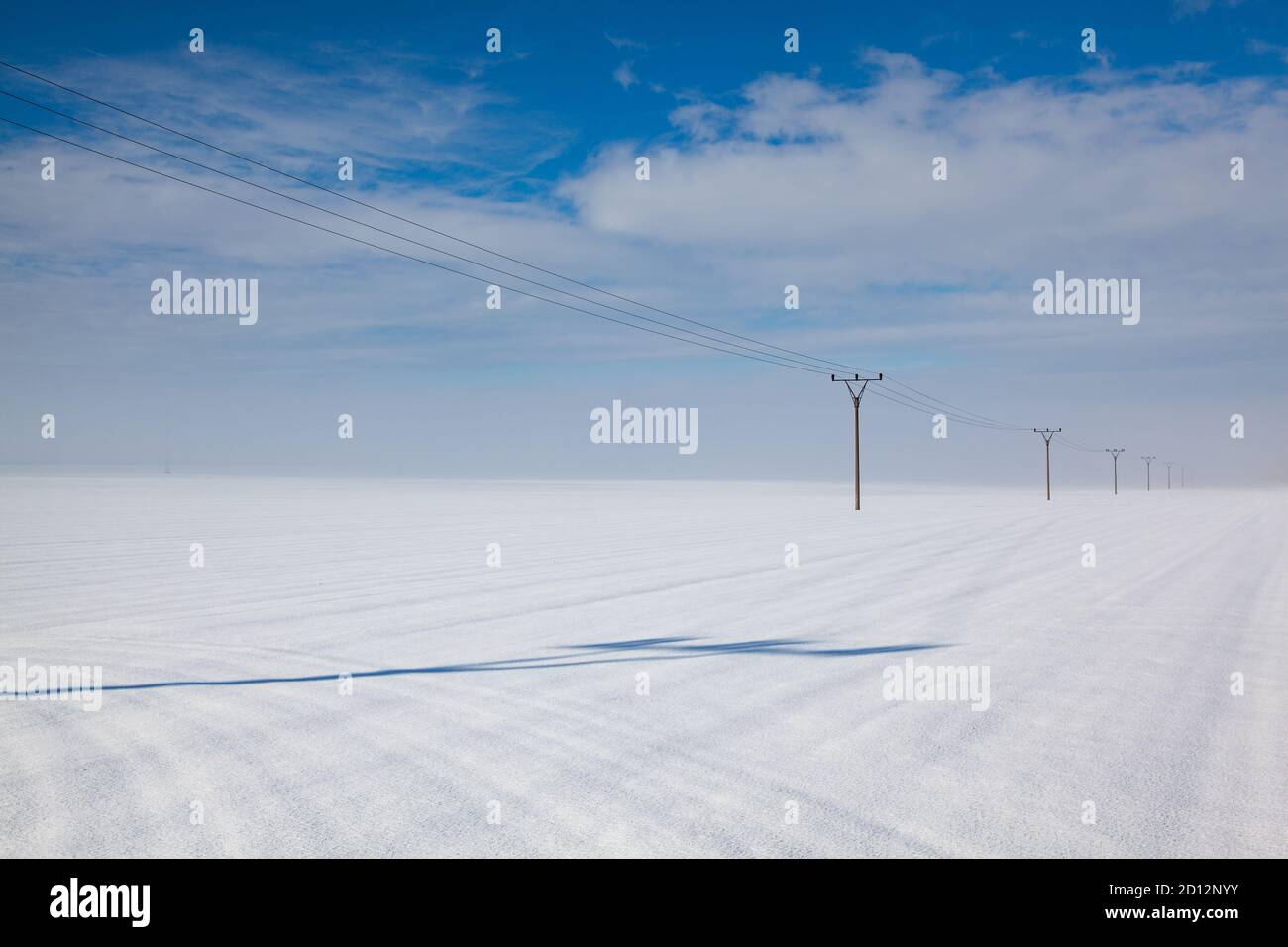 Winter landscape with power line columns a snow covered field Stock ...