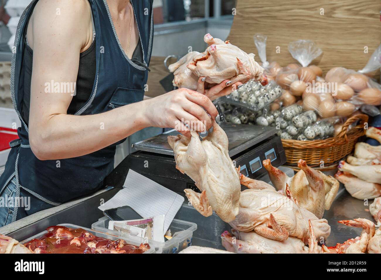 seller keeps fresh home-made chicken carcass on the counter of the meat ...