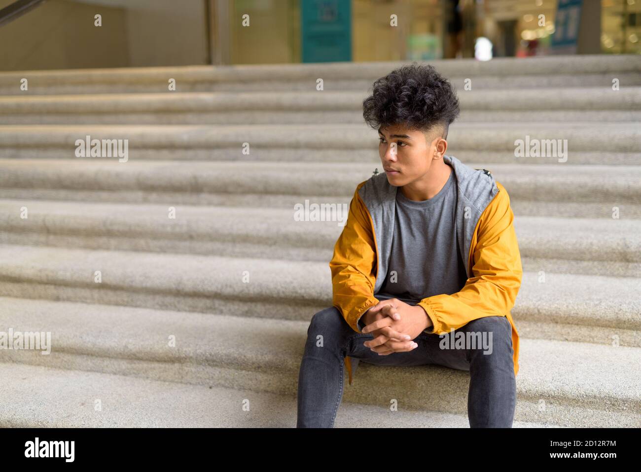 Man sitting on step hi-res stock photography and images - Alamy