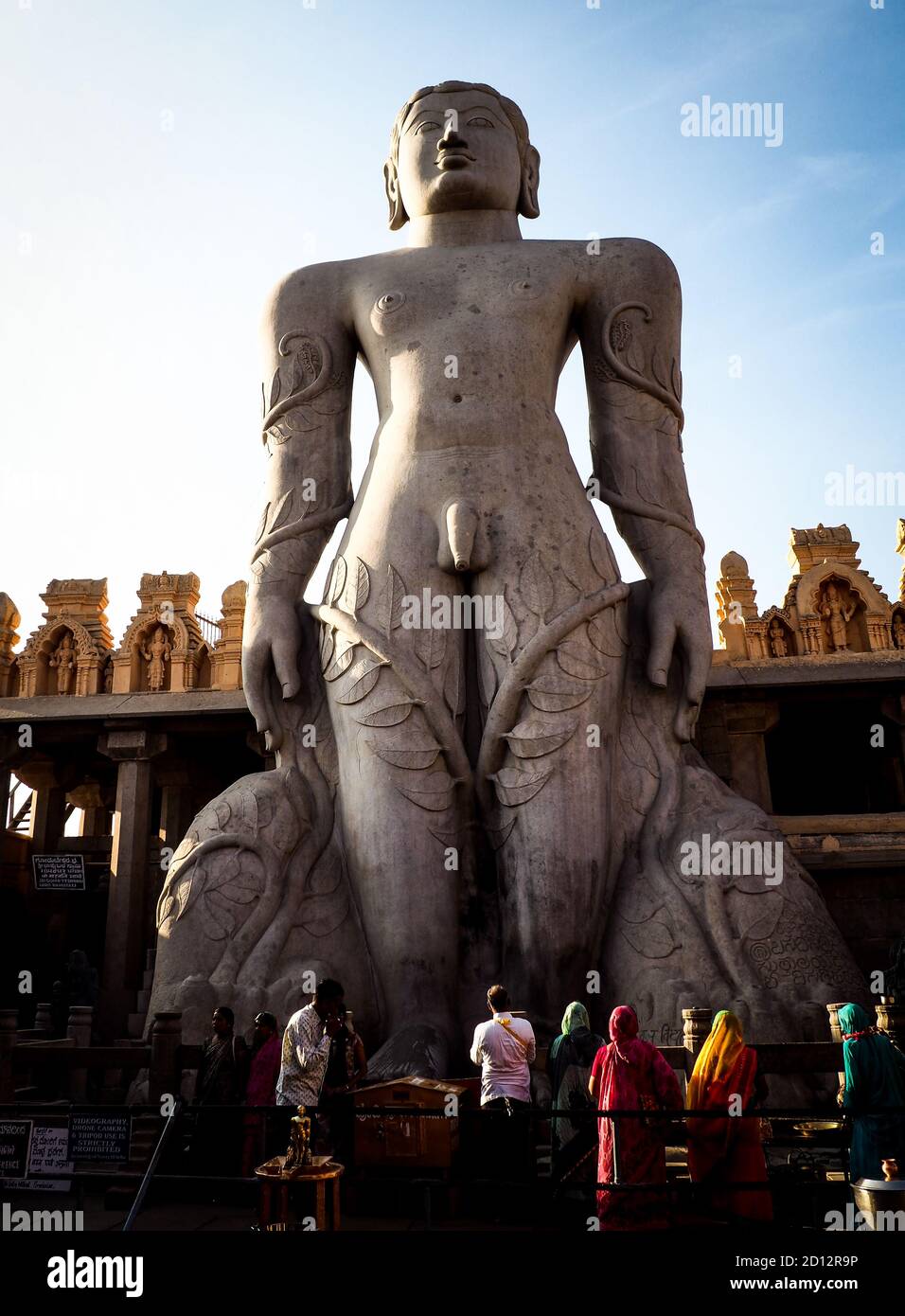 Statue of Jain god in sacred temple in Shravanabelagola in South of India during the morning ...
