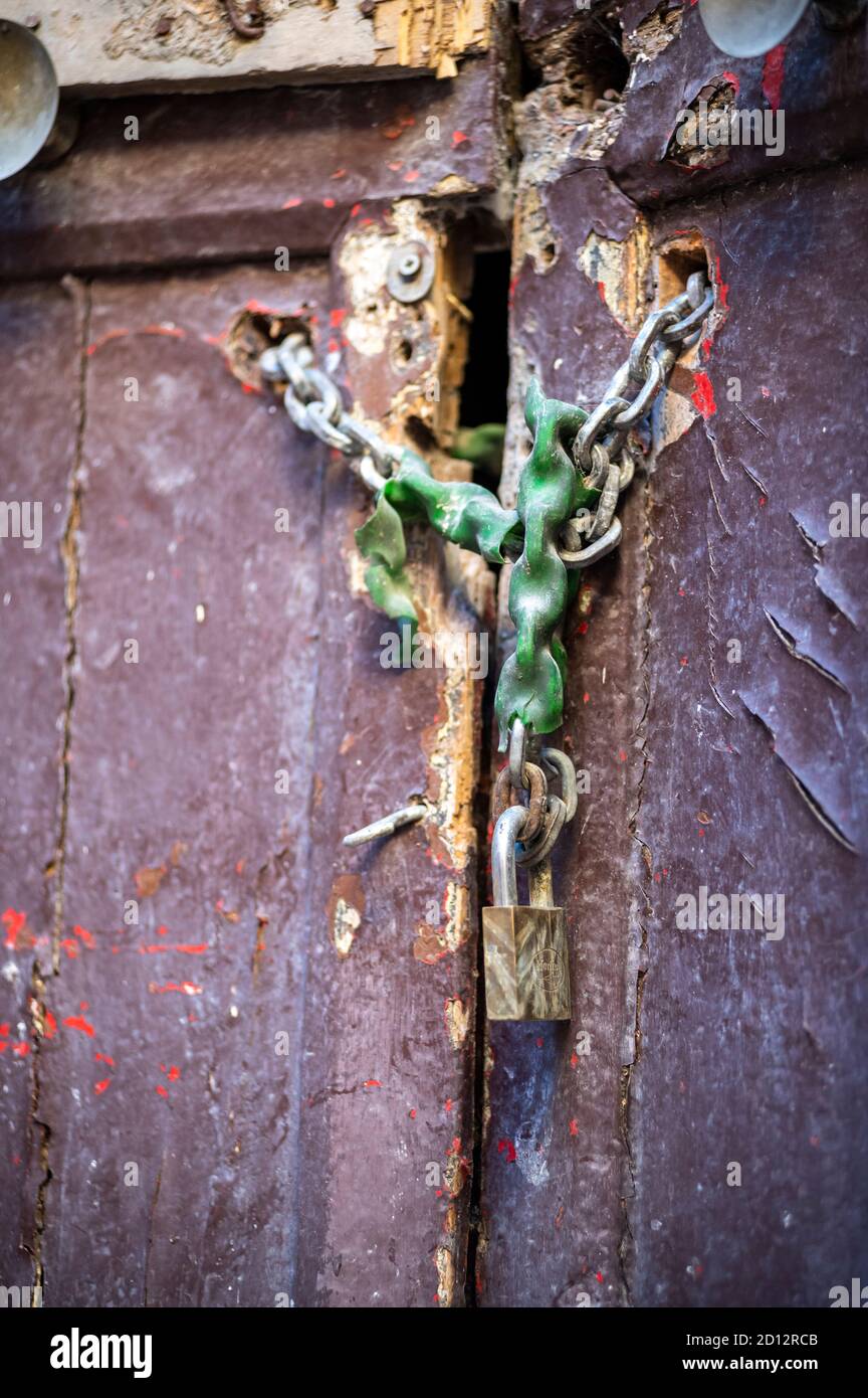 door of an abandoned building with lock and chain Stock Photo - Alamy