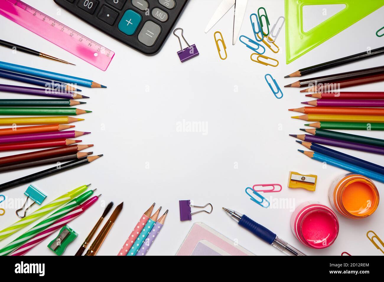 Colored school supplies for learning on a white background. Back to ...