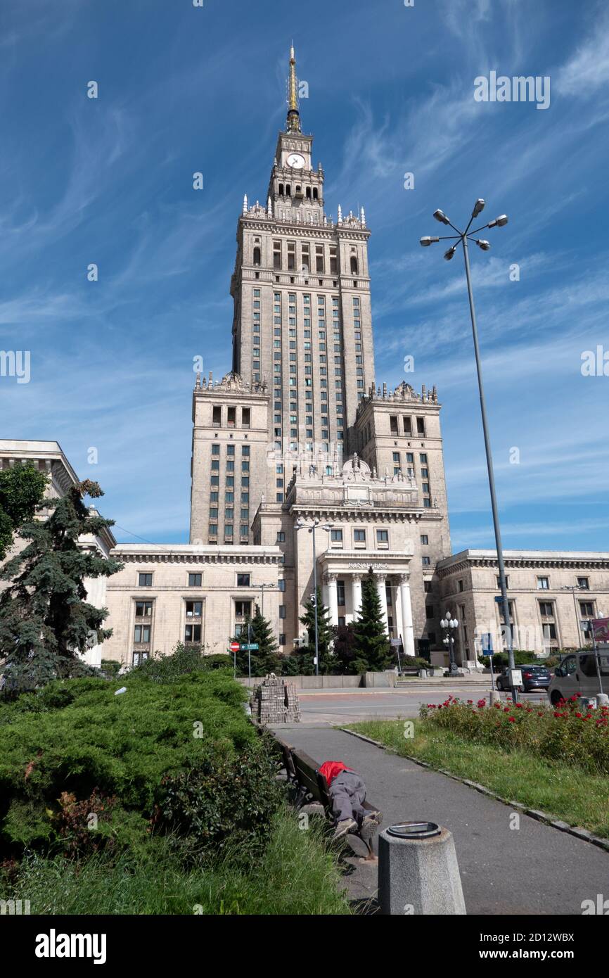 Homeless man sleeping near the Palace of Culture and Science in Warsaw ...