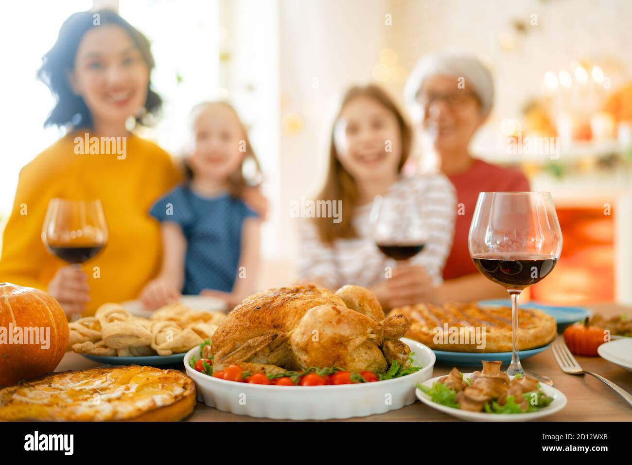 Happy Thanksgiving Day! Autumn feast. Family sitting at the table and ...