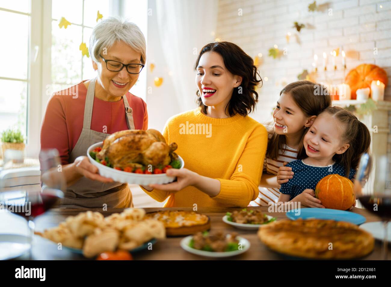 Happy Thanksgiving Day! Autumn feast. Family sitting at the table and ...