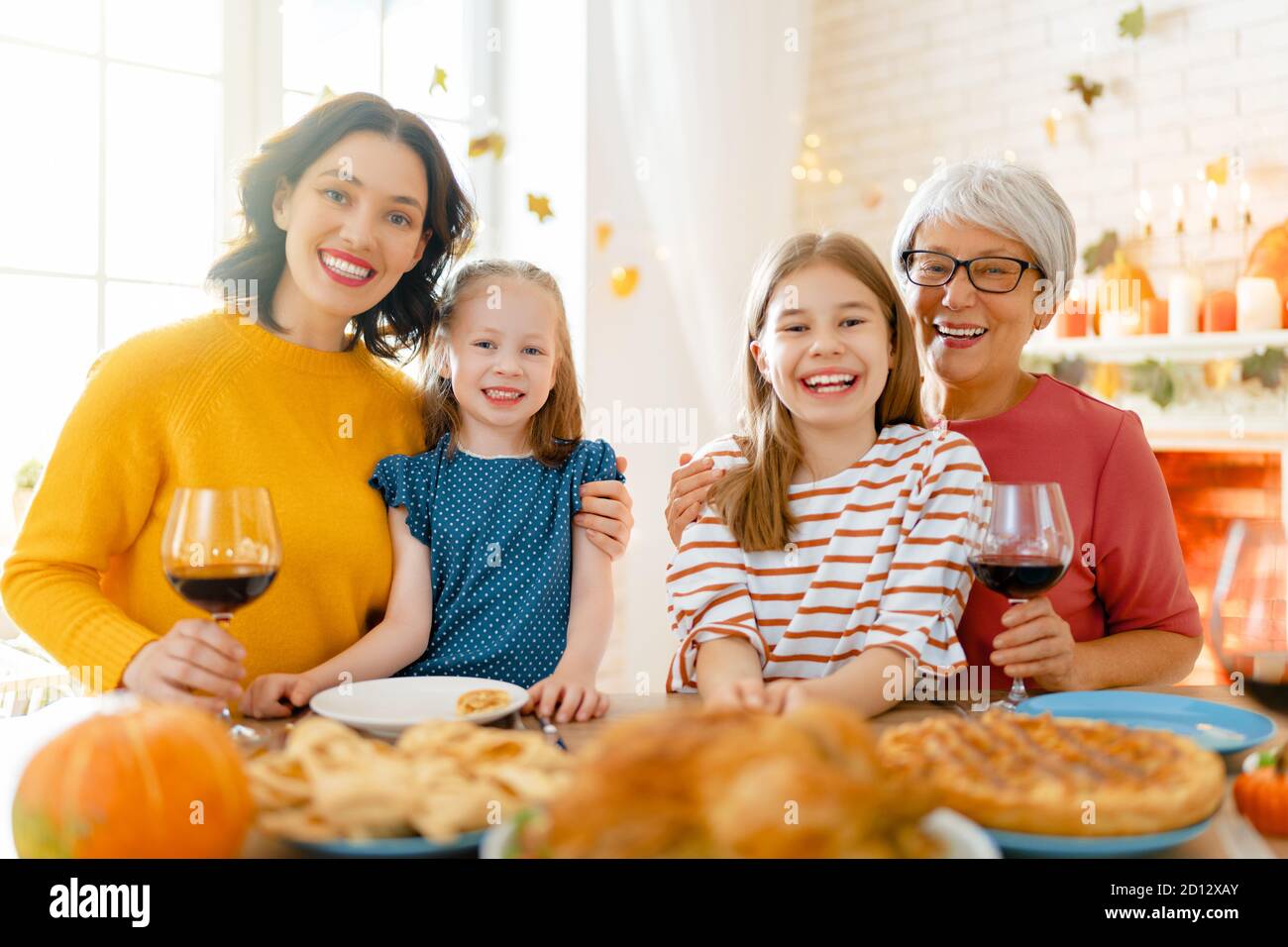 Happy Thanksgiving Day! Autumn feast. Family sitting at the table and ...