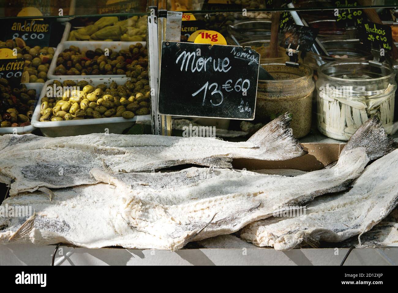 Market stall with dry salted cod fish and vegetables at Parisian street ...