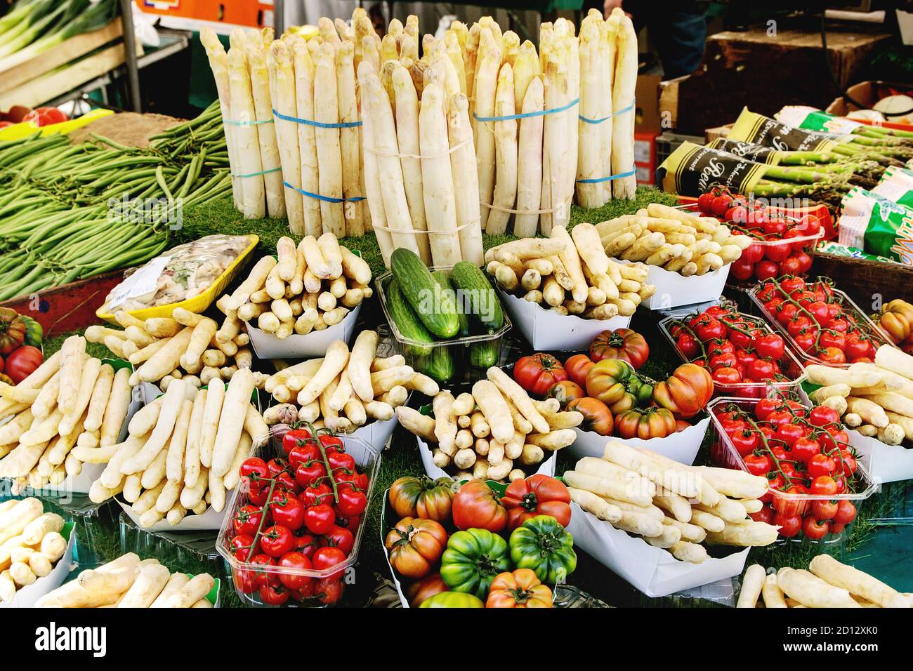 Market stall with fresh spring season vegetables at Parisian street ...