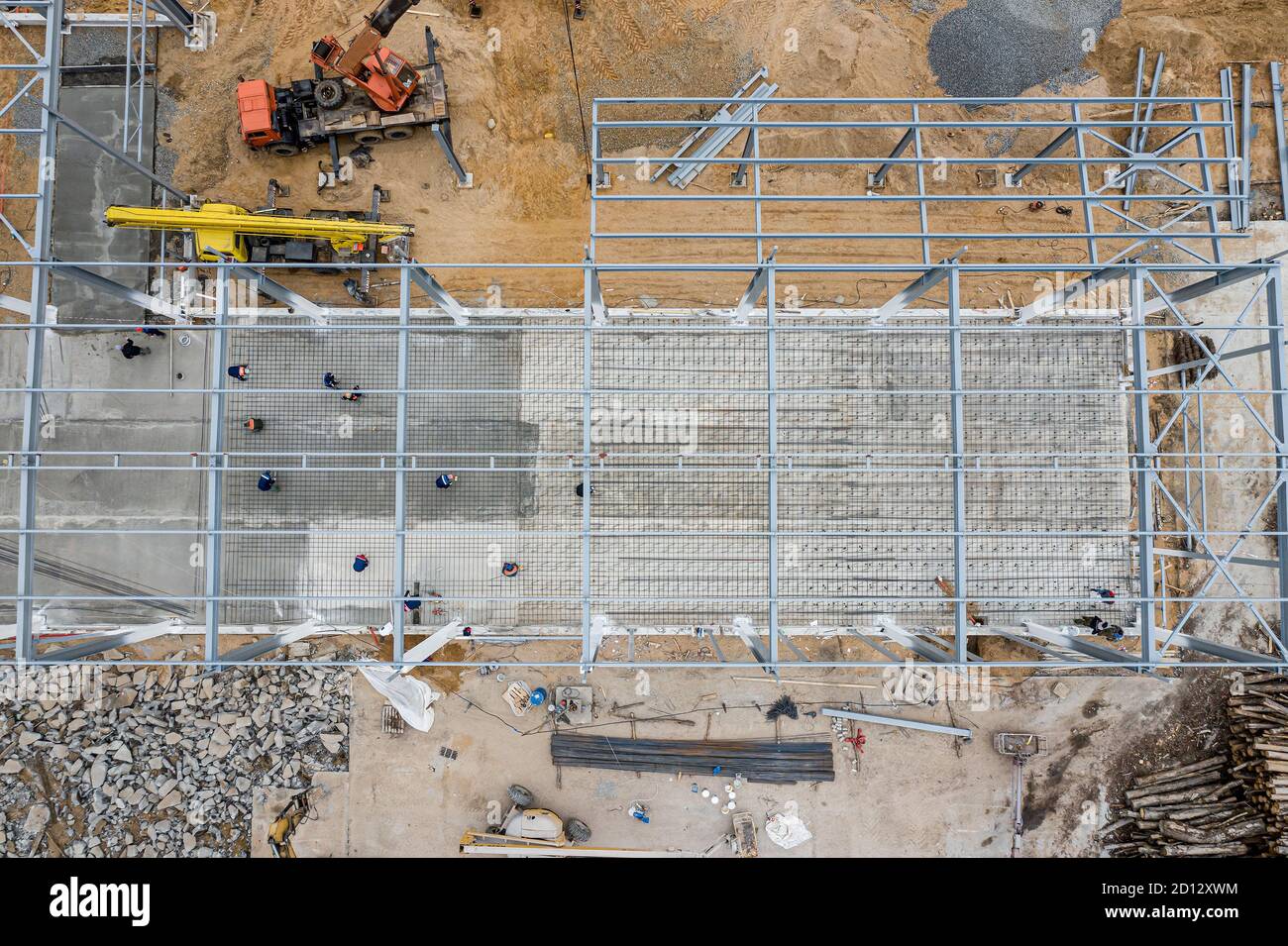 workers fill the concrete floor in the building top view Stock Photo ...