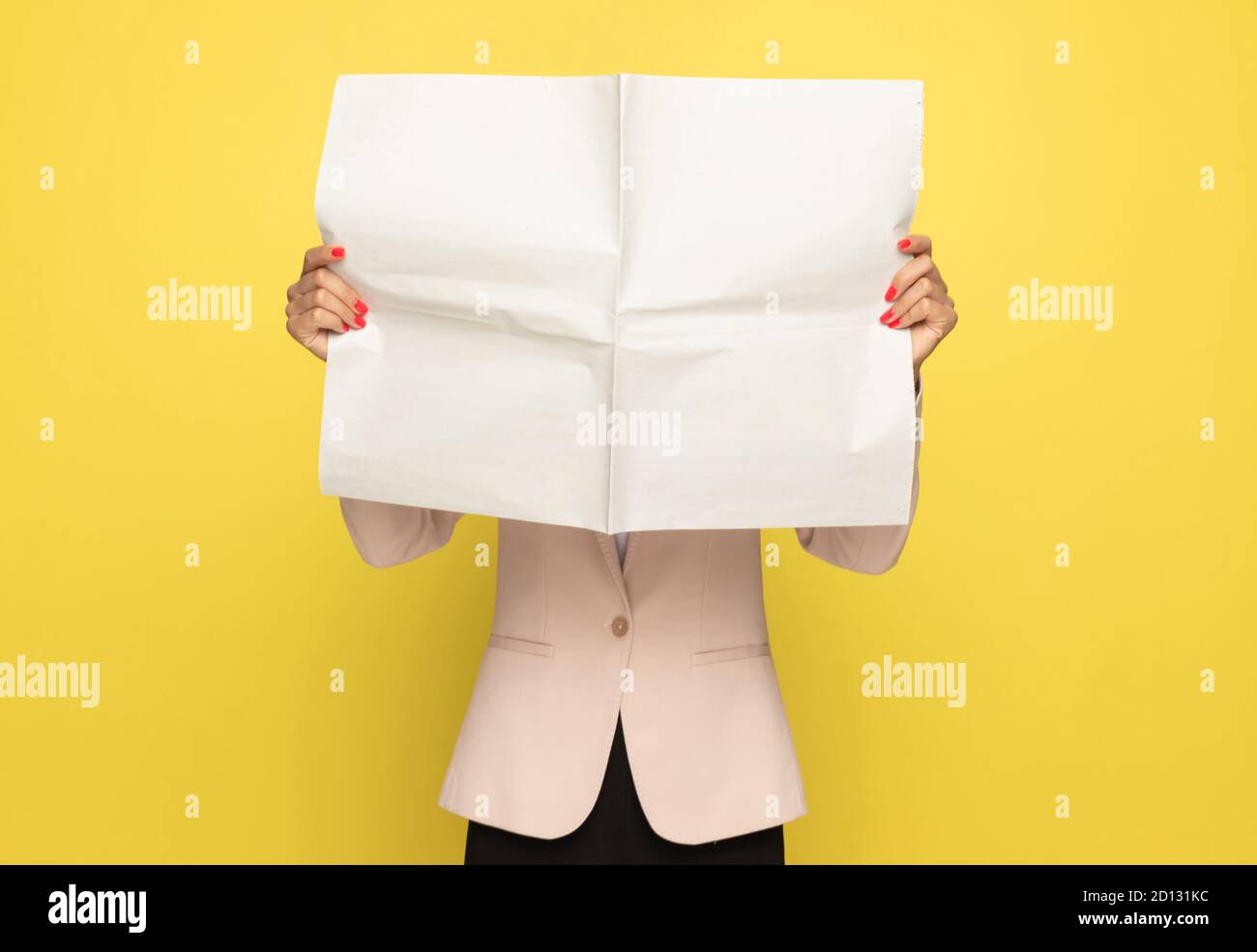 Young woman covering face newspaper hi-res stock photography and images ...