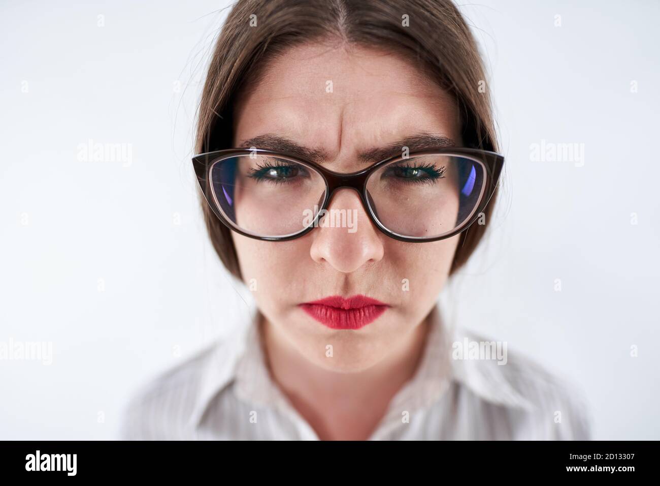 Wide angle closeup of a young businesswoman frowning in anger Stock ...