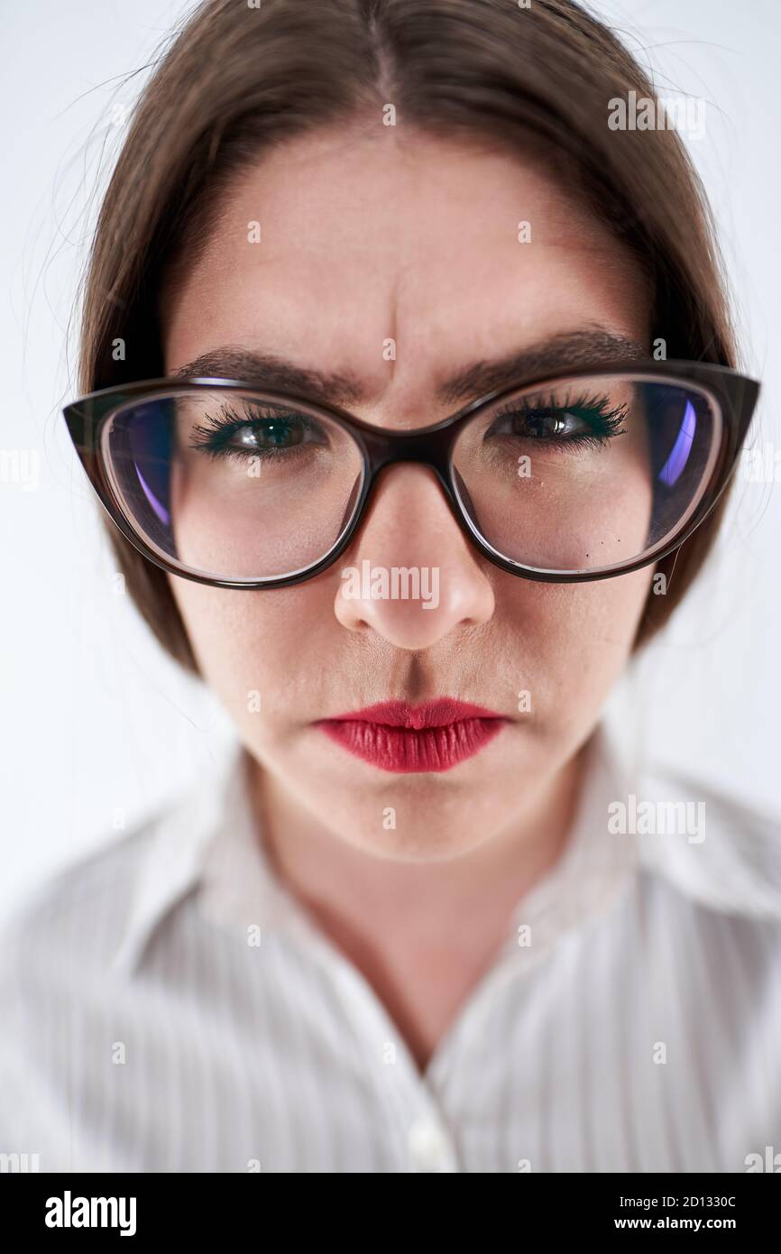 Wide angle closeup of a young businesswoman frowning in anger Stock ...