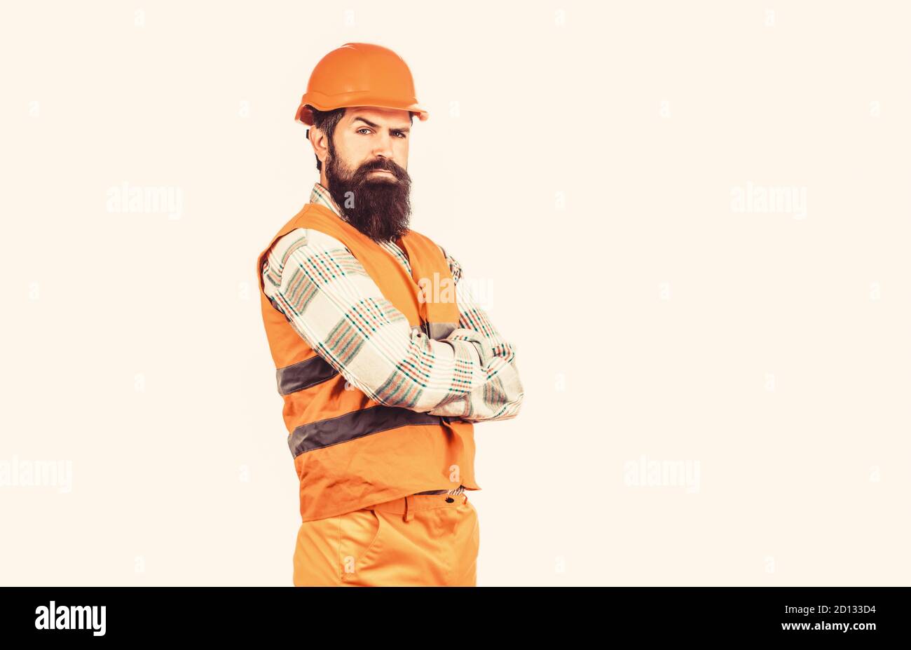 Builder in hard hat, foreman or repairman in the helmet. Worker in ...