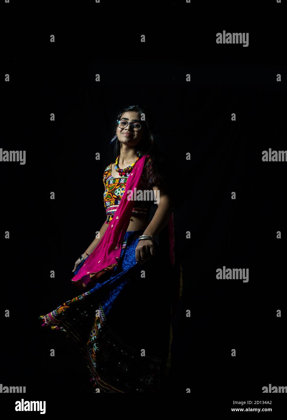 Indian girl in traditional chaniya choli for navratri with a ...
