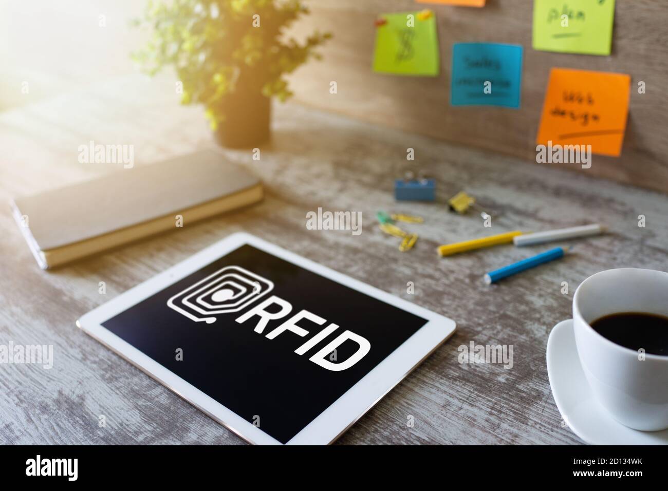 RFID Radio frequency identification technology concept on device screen ...