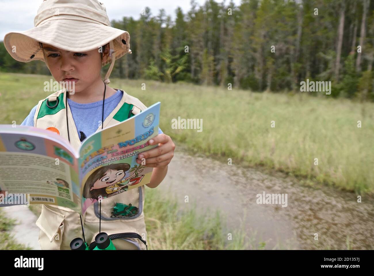 Girl learning about nature in an outdoor class Stock Photo - Alamy