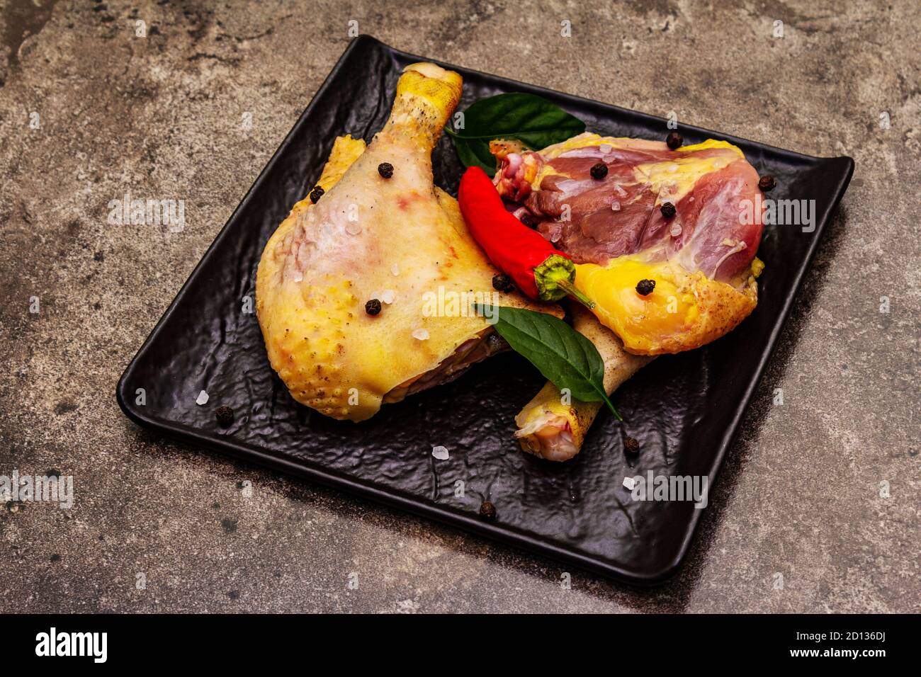 Raw BIO organic chicken legs. Fresh natural meat with vegetables and ...