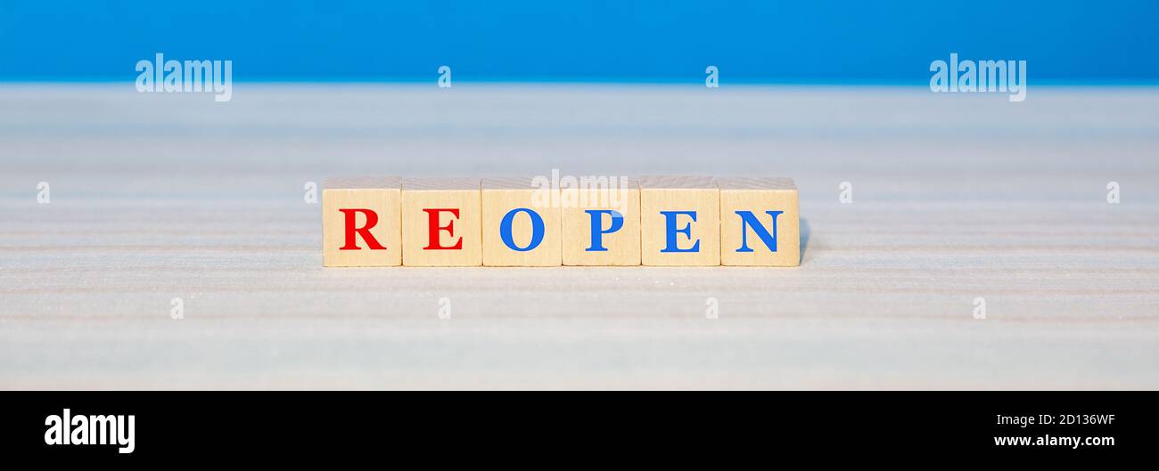 word REOPEN on Wooden blocks, business reopening plan post covid-19 ...