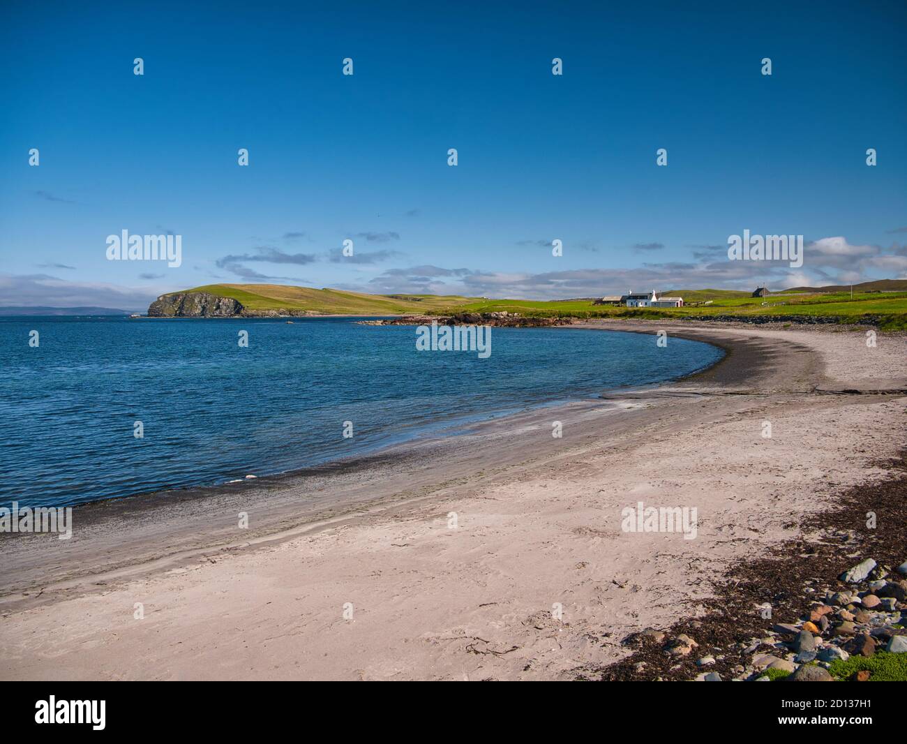 With the headland of the Neap of Norby in the distance, the sand beach ...