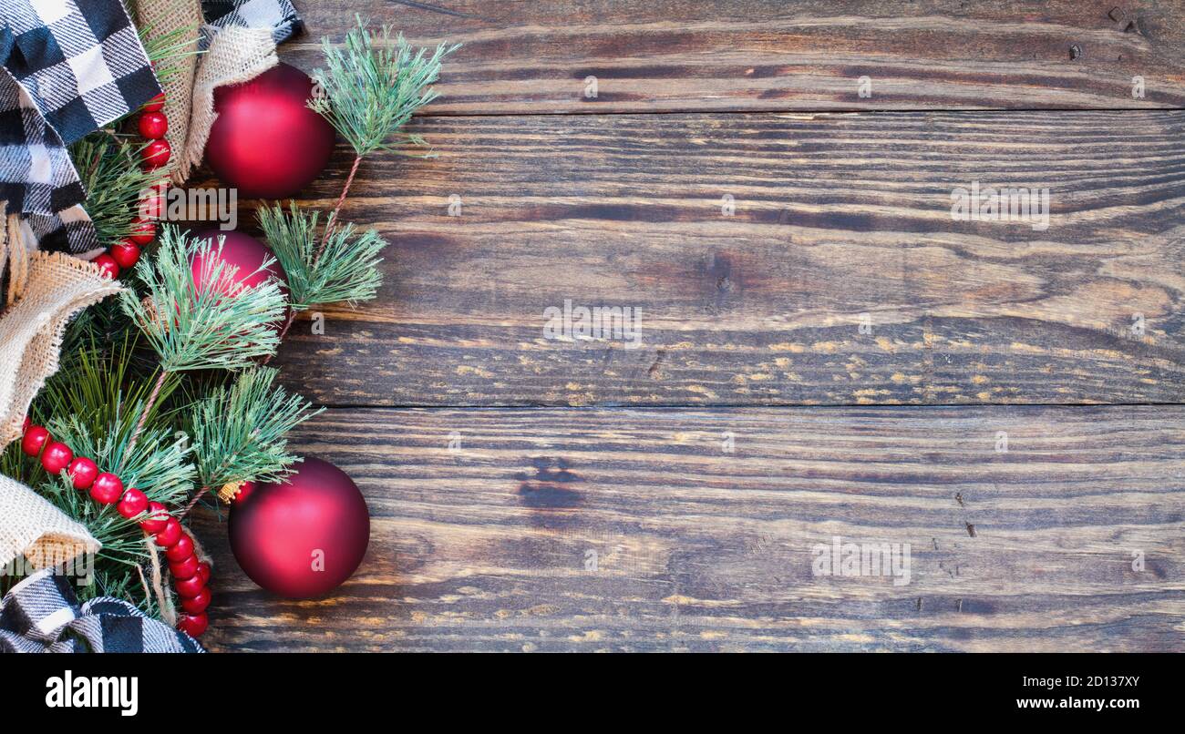 Christmas background with holiday trimmings of pine tree branches ...