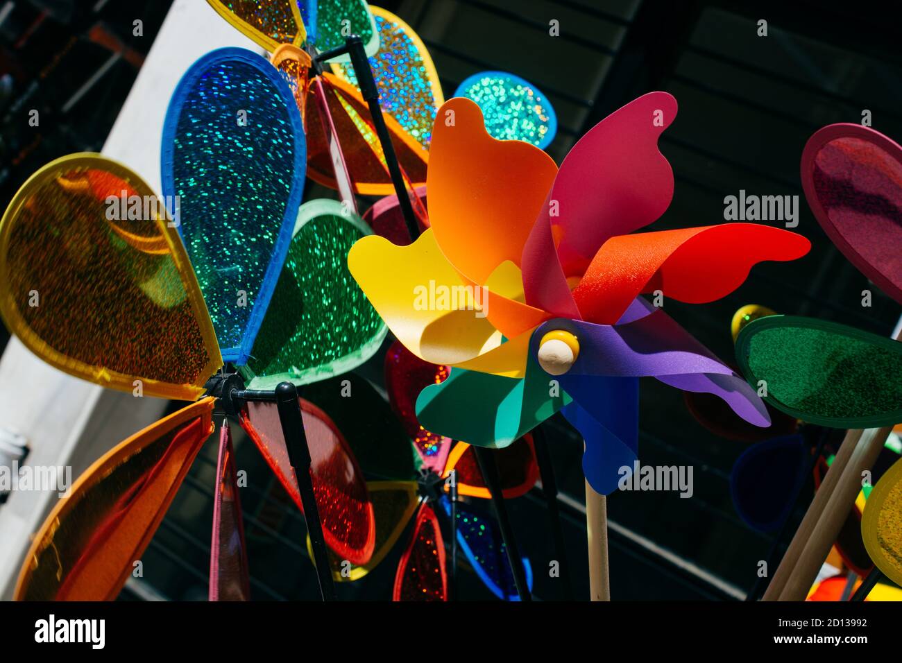 Rainbow colored pinwheels on sale in the view Stock Photo - Alamy
