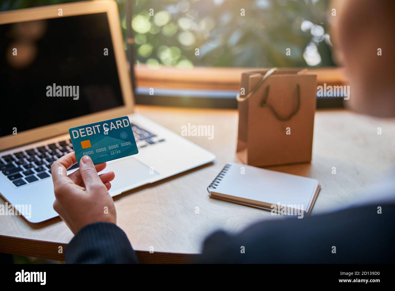 Focused photo on female hand which holding debit card Stock Photo - Alamy