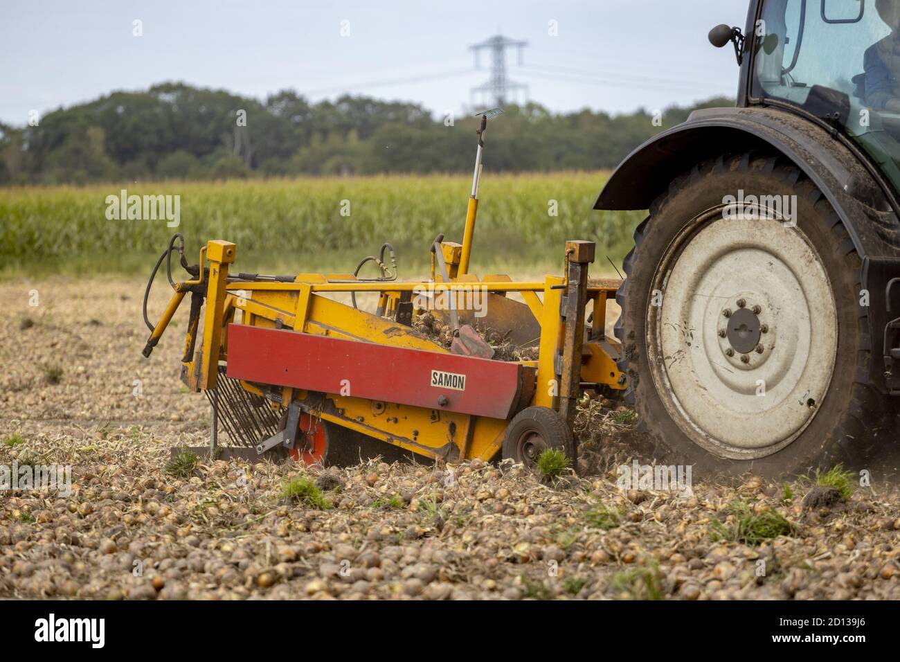 Closeup of grubbing machine behind tractor Stock Photo - Alamy