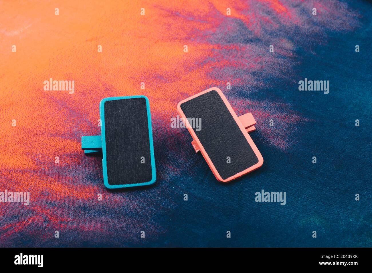 Two color noticeboards on a colorful background on display Stock Photo ...