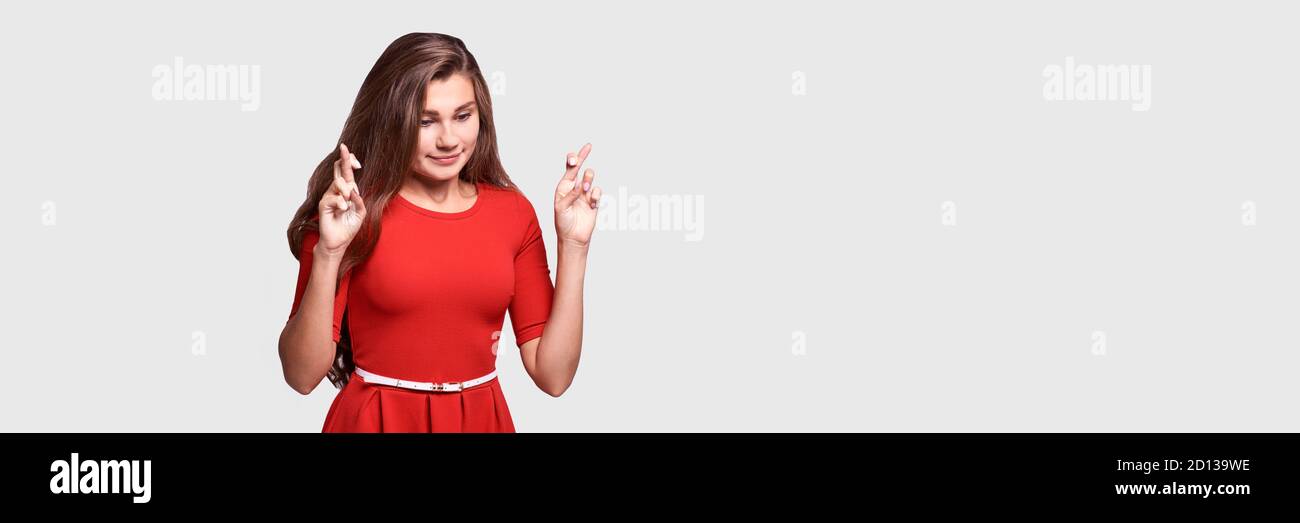 Beautiful girl. Make wish. Concentrated Look Stock Photo - Alamy