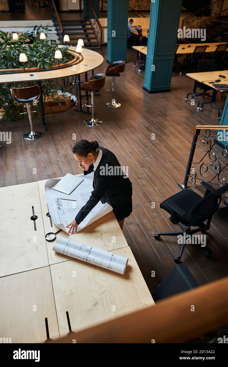Busy architect working at her project alone Stock Photo - Alamy