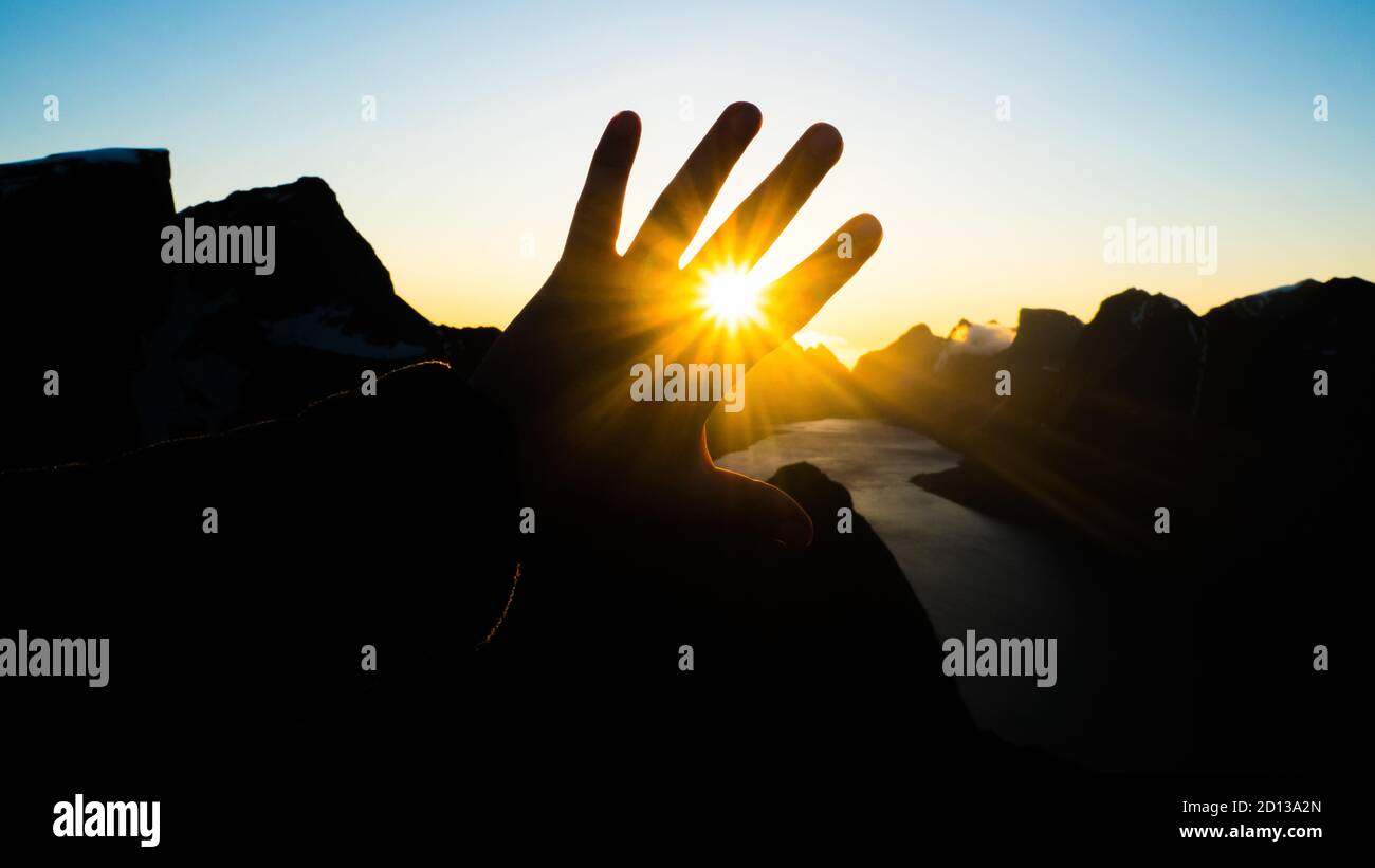 Hand Reaching Out Sun High Resolution Stock Photography and Images - Alamy