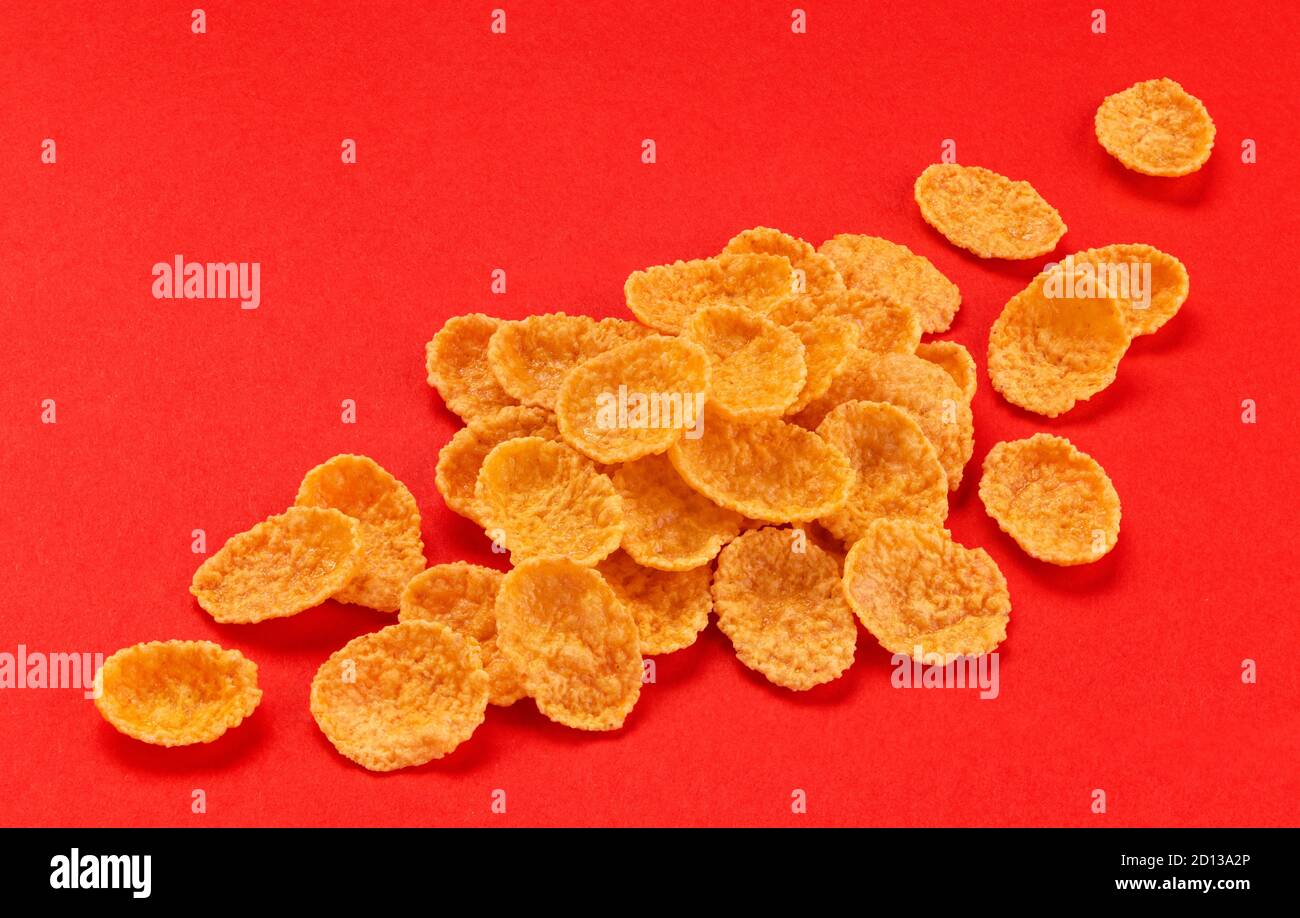 Corn flakes isolated on red color background, full depth of field Stock ...