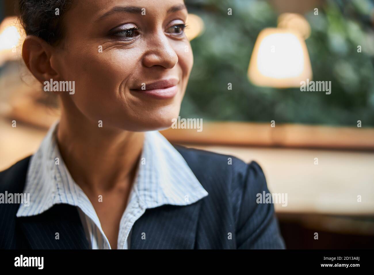 Portrait of kind woman that being deep in thoughts Stock Photo - Alamy