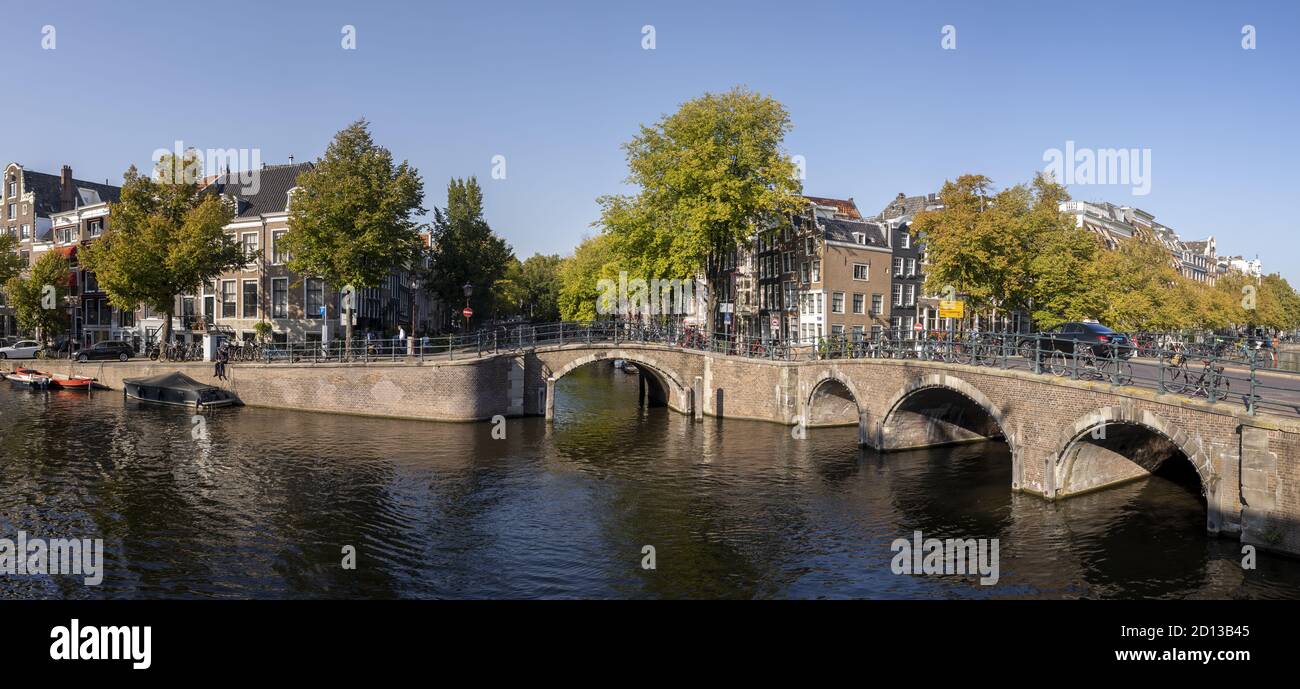 AMSTERDAM, NETHERLANDS - Sep 22, 2020: Long quay panorama of typical ...
