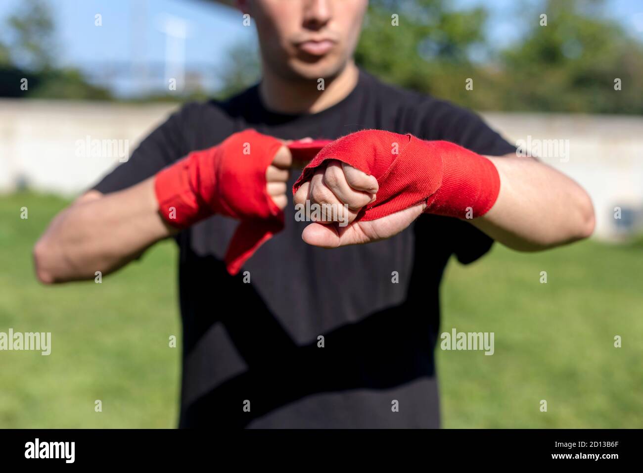 Boxer preparing for training with forearm bandage outdoors Stock Photo ...
