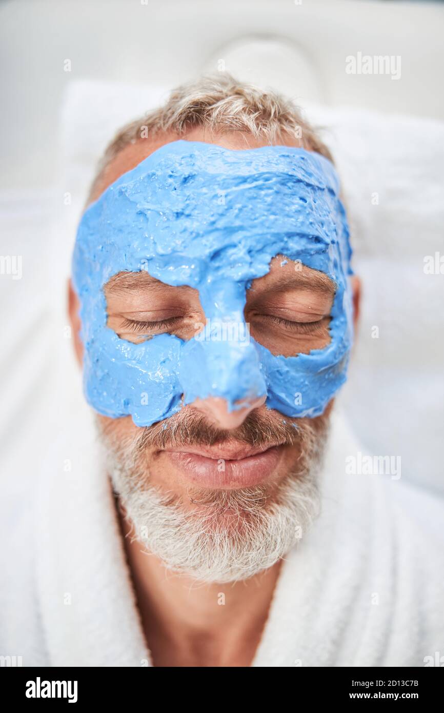Senior citizen having a moisturizing facial mask Stock Photo - Alamy