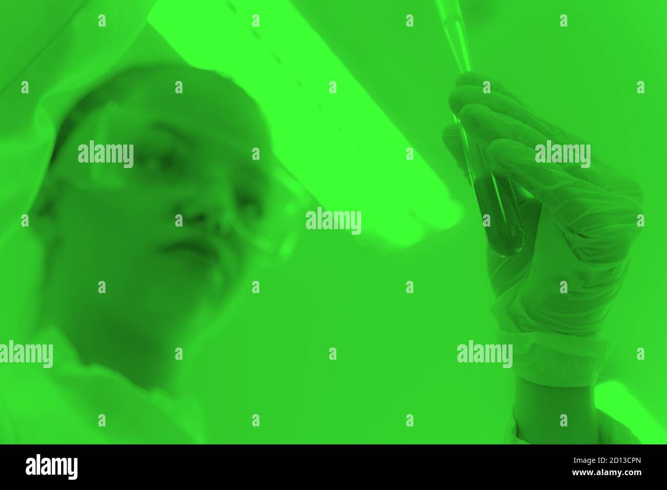 Young Female Laboratory scientist working at lab with test tubes, test ...