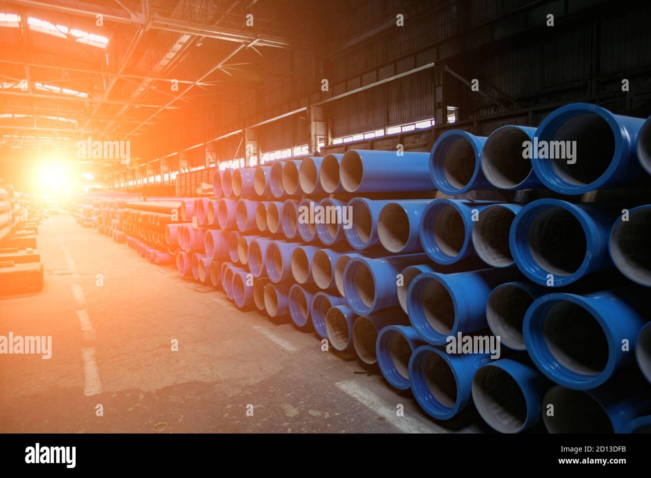New cast iron pipes for pipeline construction in warehouse Stock Photo ...