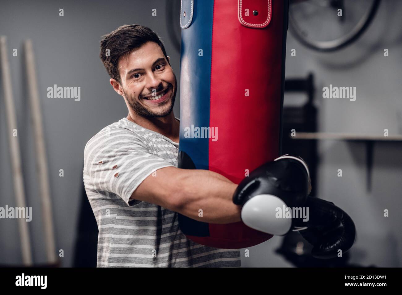 an athlete boxer poses for a photo session in the hall where he is ...