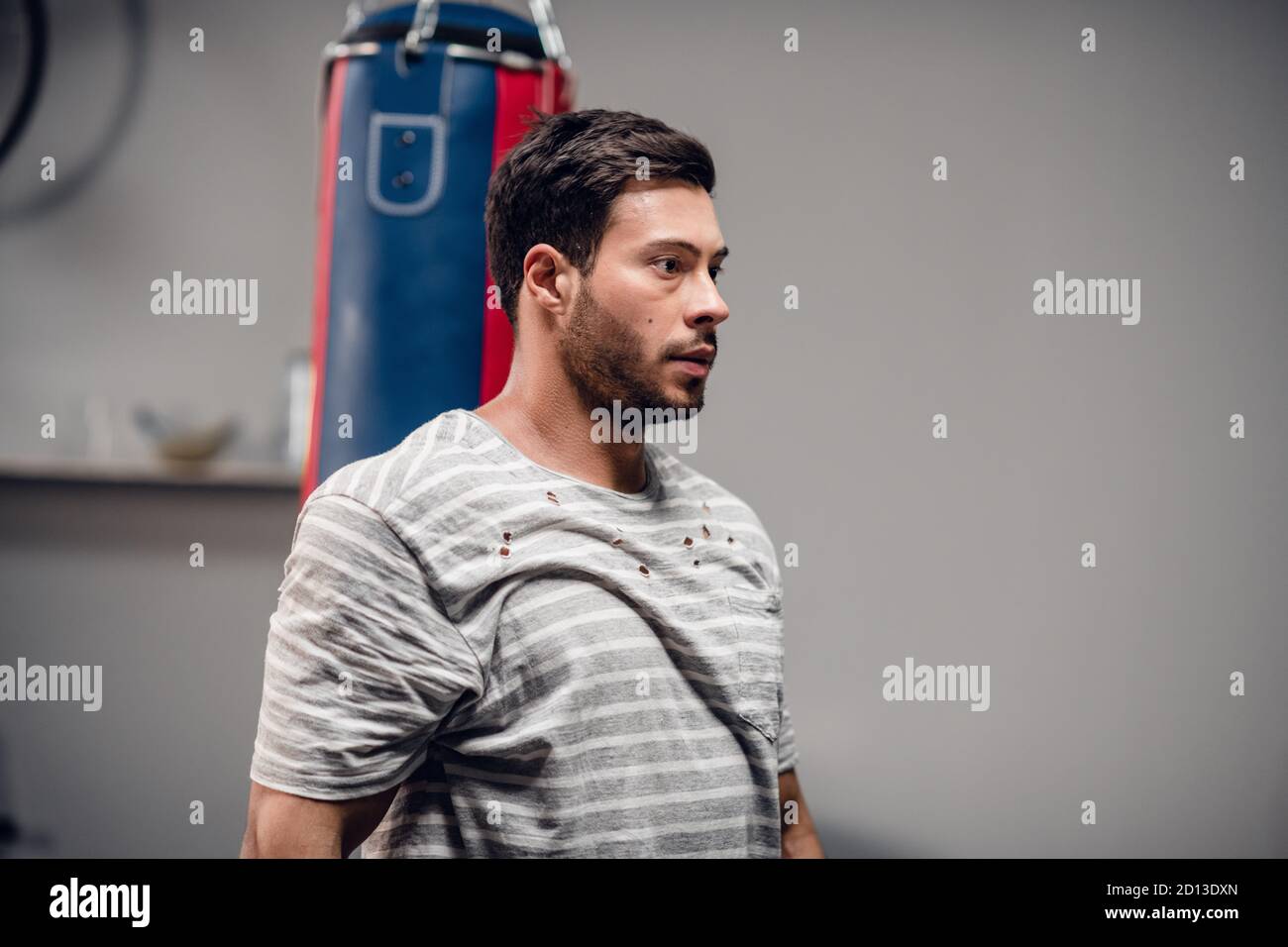 Boxing coach a young male boxer sets up for training in the gym Stock ...