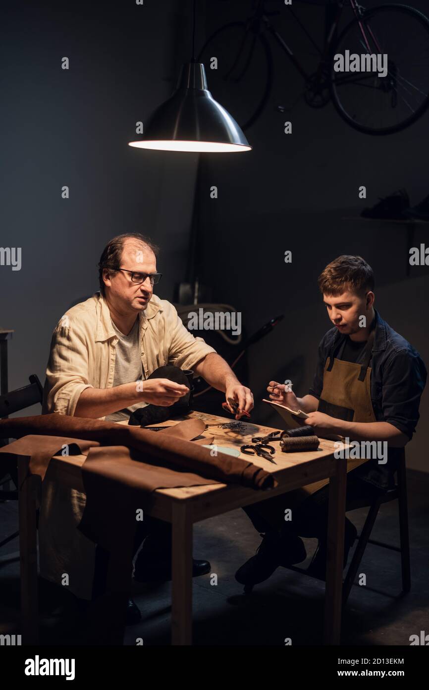 Father son hammer working workshop hi-res stock photography and images ...