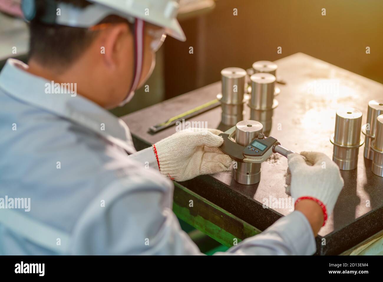 Production worker use outside micrometer inspection high metal product ...